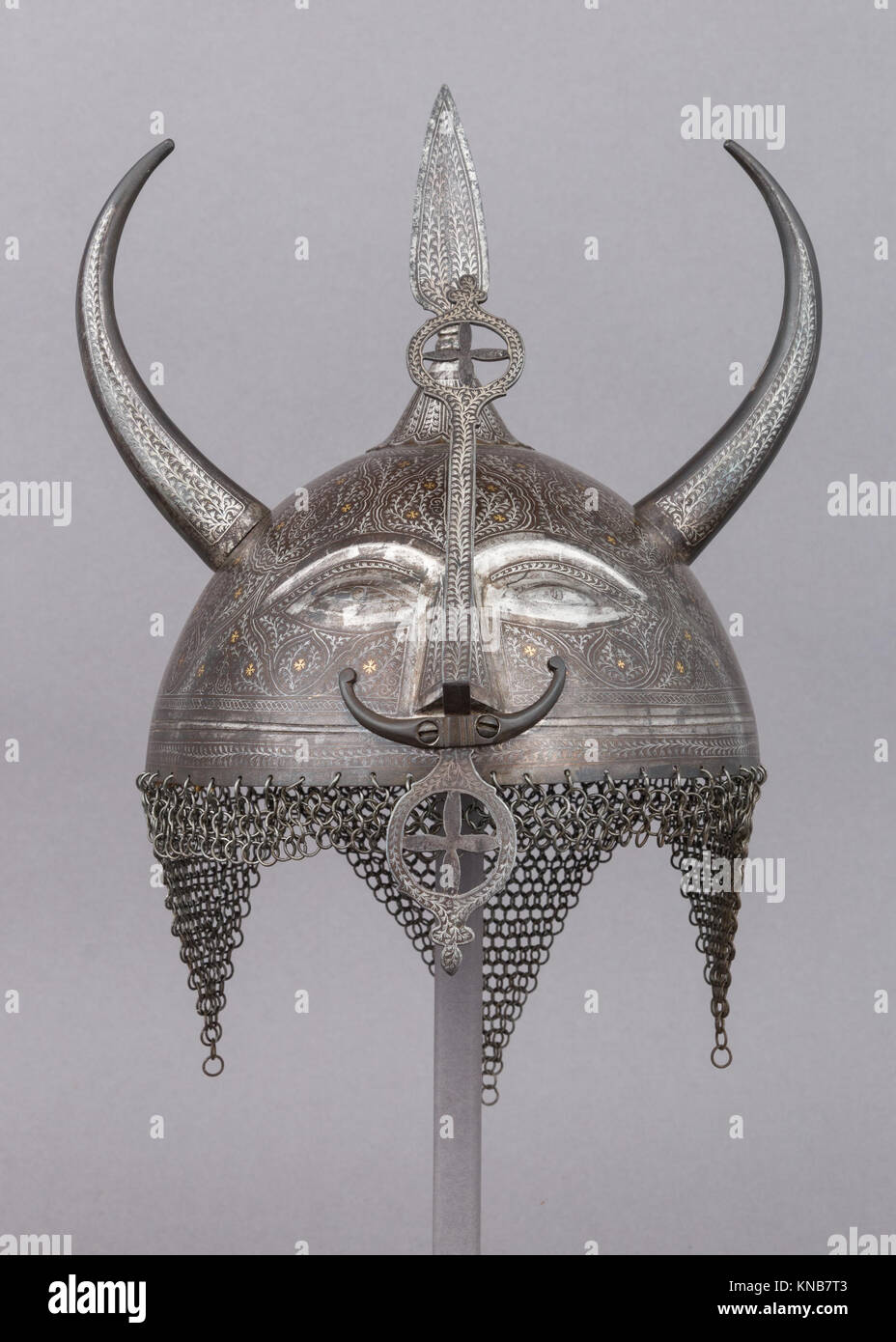 This helmet, identified as a Khula Khud, features distinctive horns. It ...