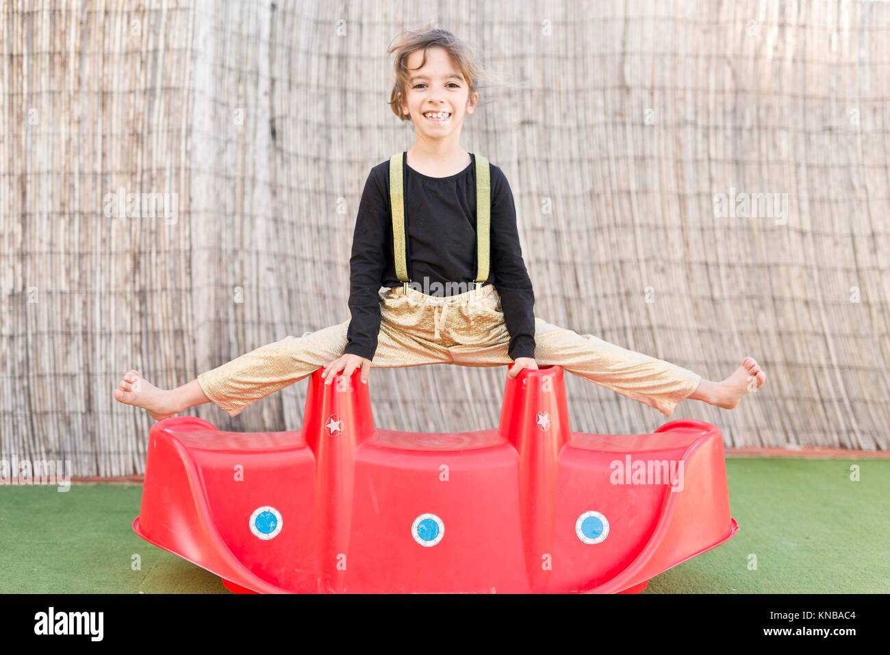 One girl playing on a floor with Astroturf Stock Photo - Alamy