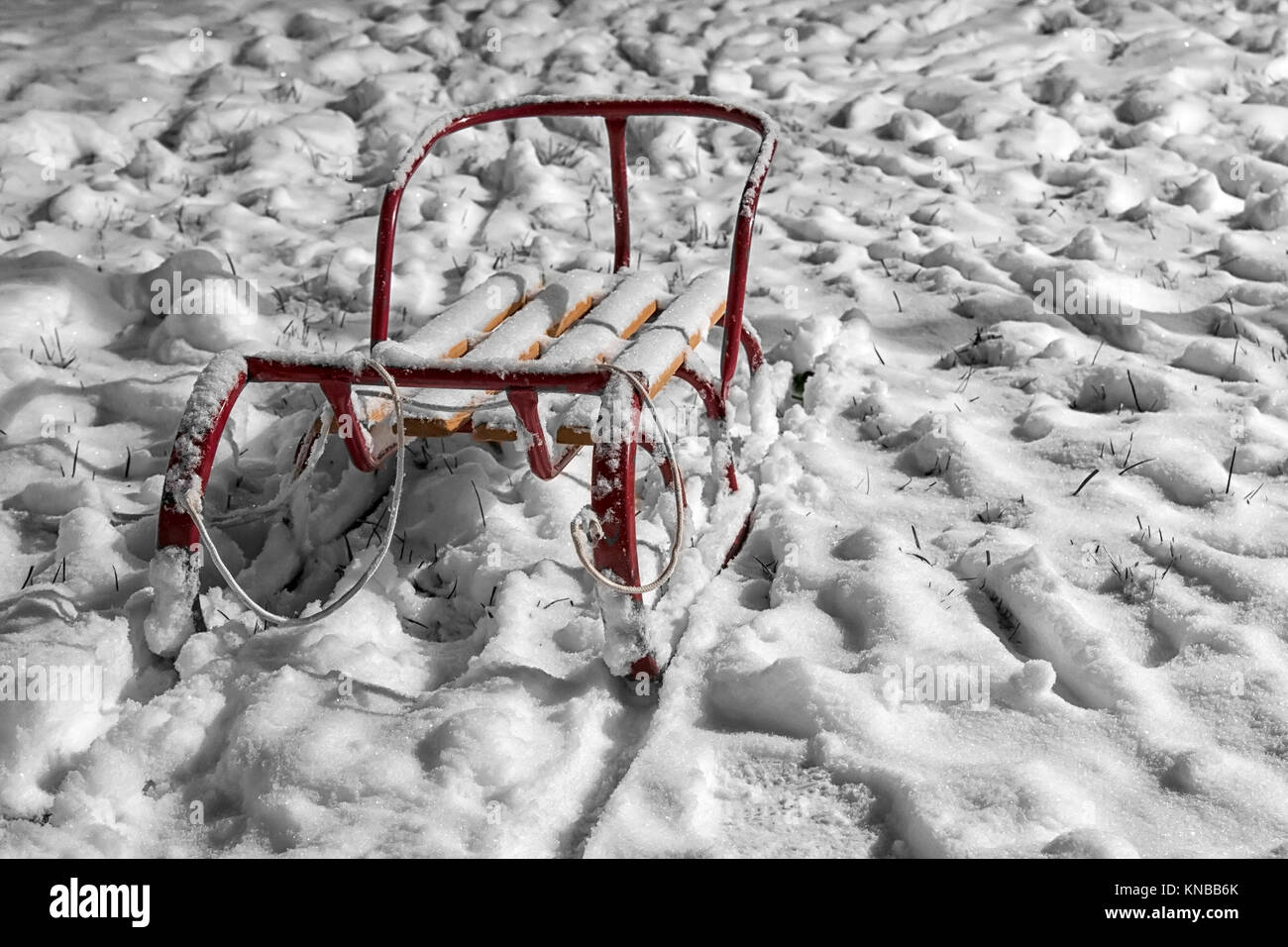 red sledge in the snow Stock Photo - Alamy