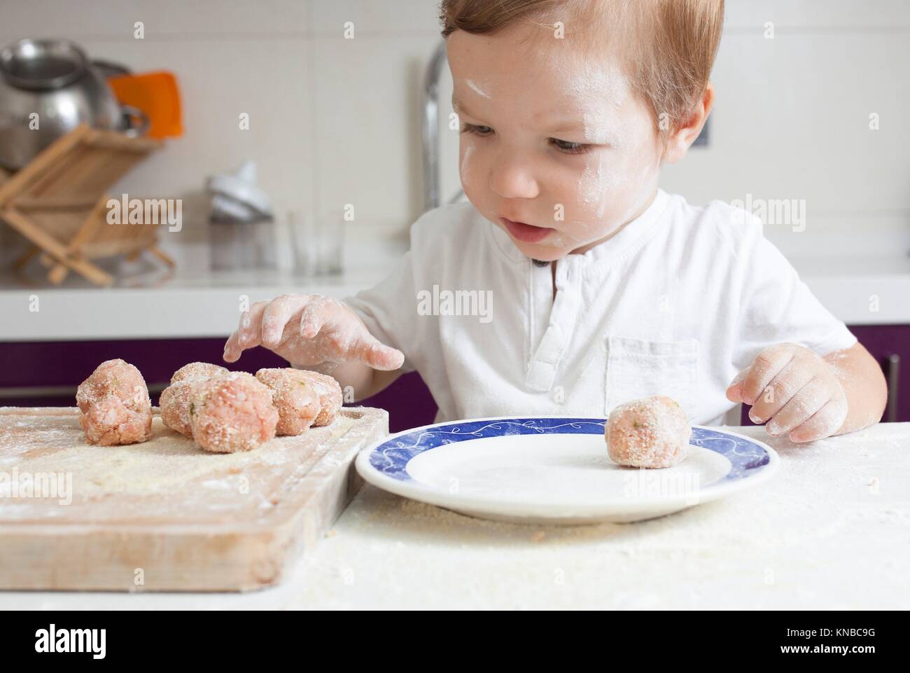 Baby holding drink hi-res stock photography and images - Alamy