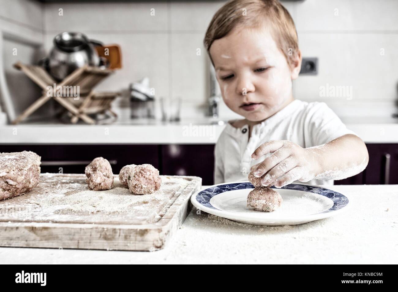 Baby holding drink hi-res stock photography and images - Alamy