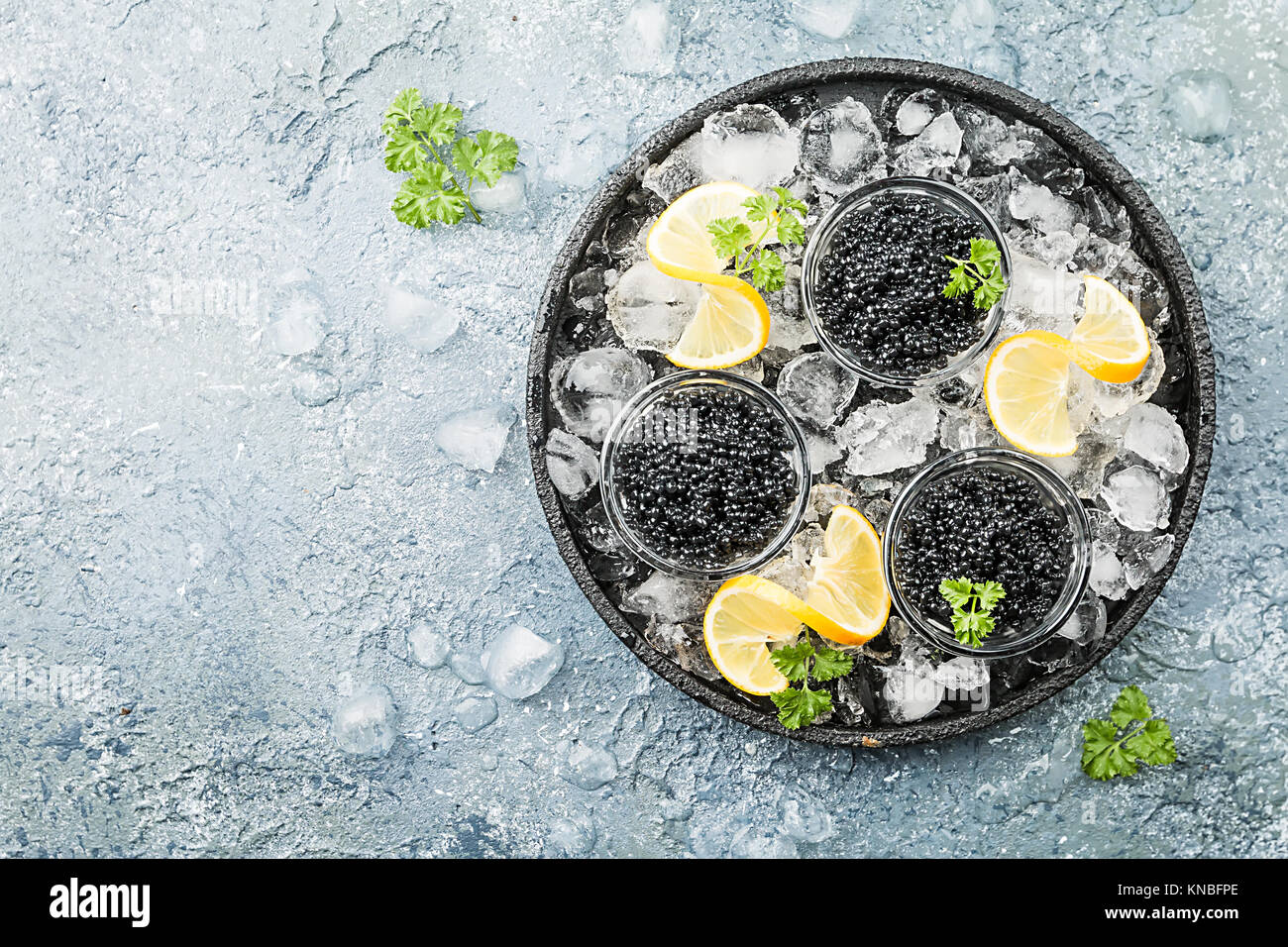 Black caviar on ice Stock Photo - Alamy