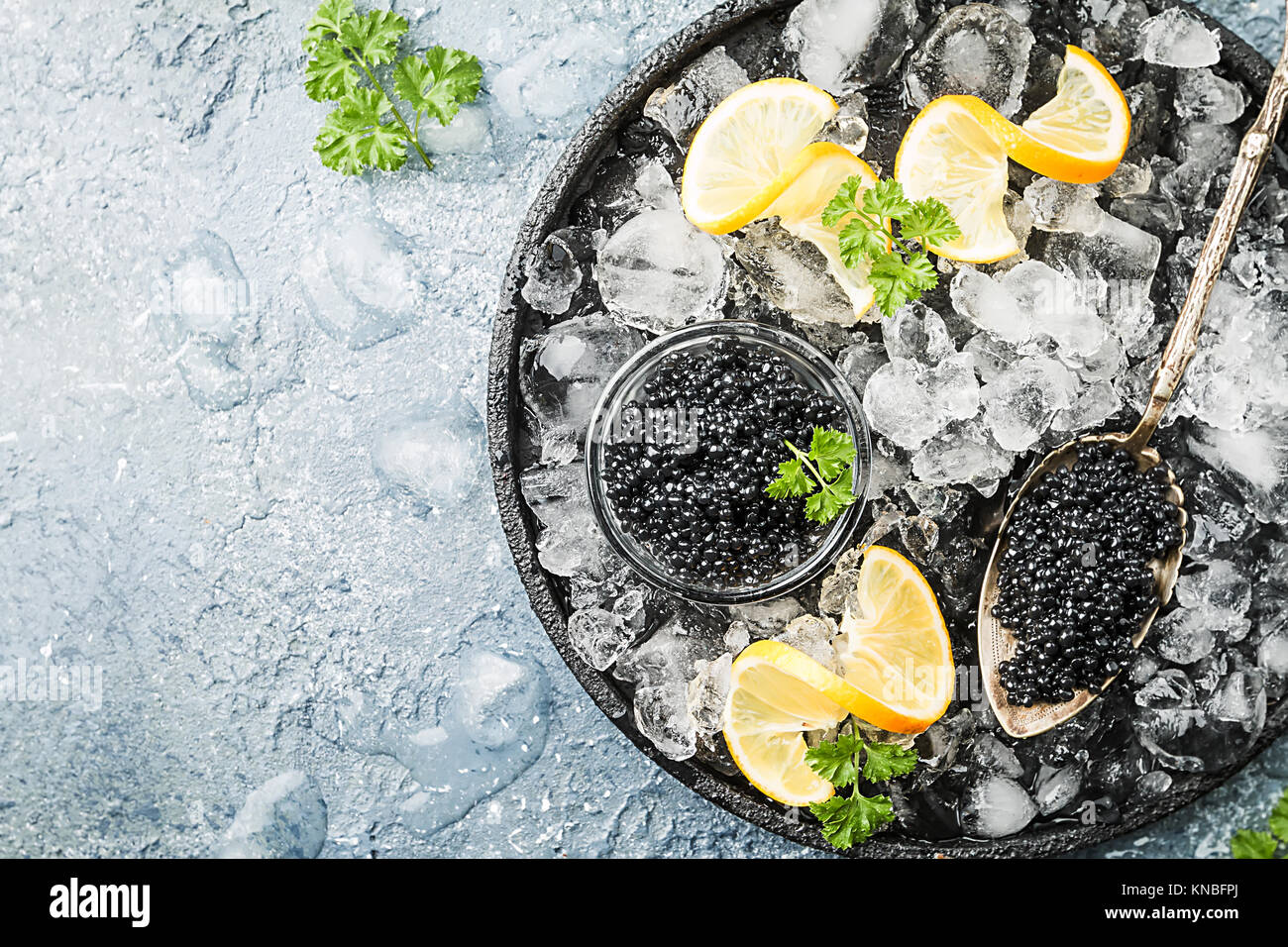 Black caviar on ice Stock Photo - Alamy