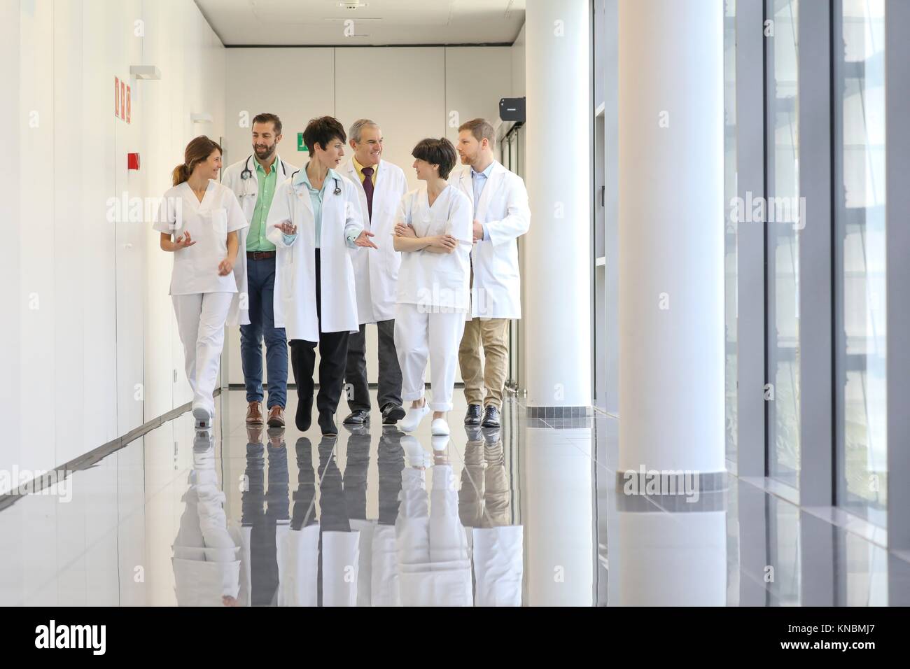 Doctors and nurses walking in corridor, Hospital Stock Photo - Alamy
