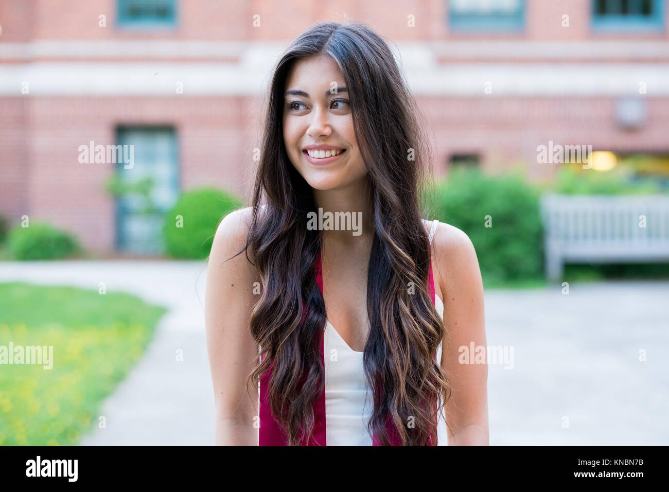 College senior picture of a graduating student on a university campus ...