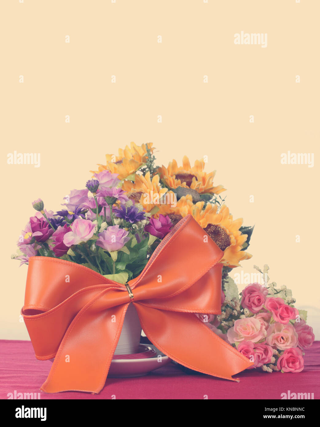 Big ribbon with colorful artificial flower Stock Photo - Alamy