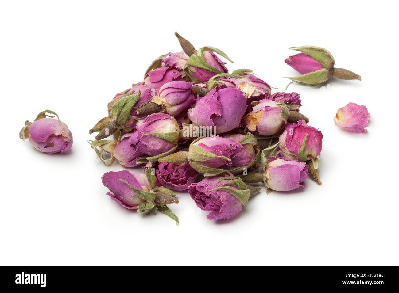 Heap of dried rose buds on white background Stock Photo - Alamy