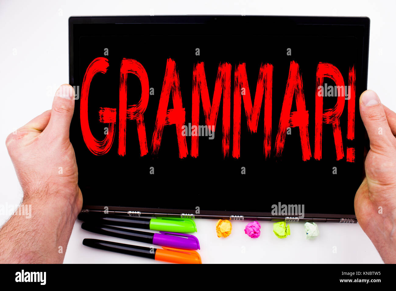Grammar text written on tablet, computer in the office with marker, pen ...