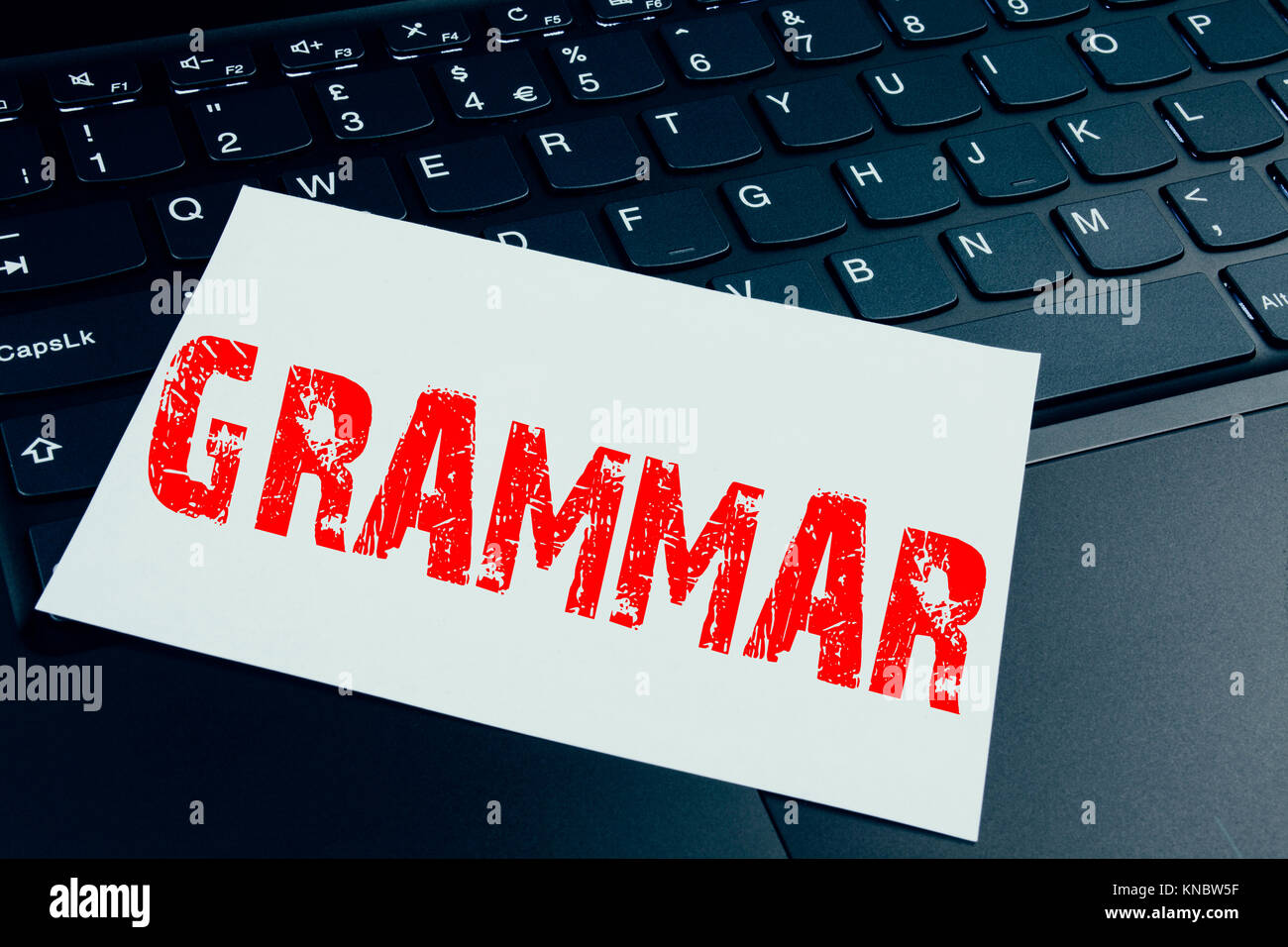 Writing Grammar text made in the office close-up on laptop computer ...