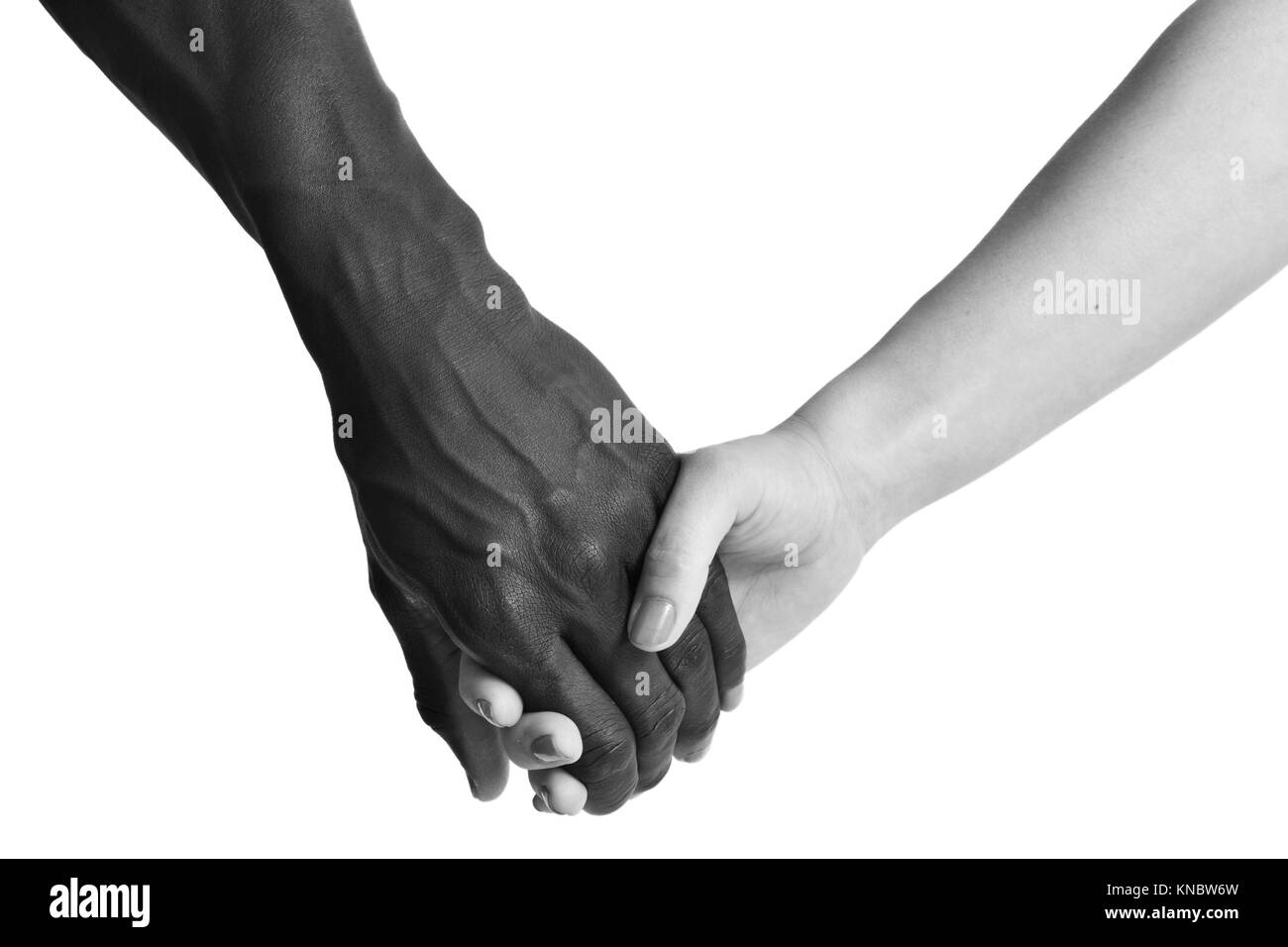 One caucasian and one african hand on white background Stock Photo - Alamy
