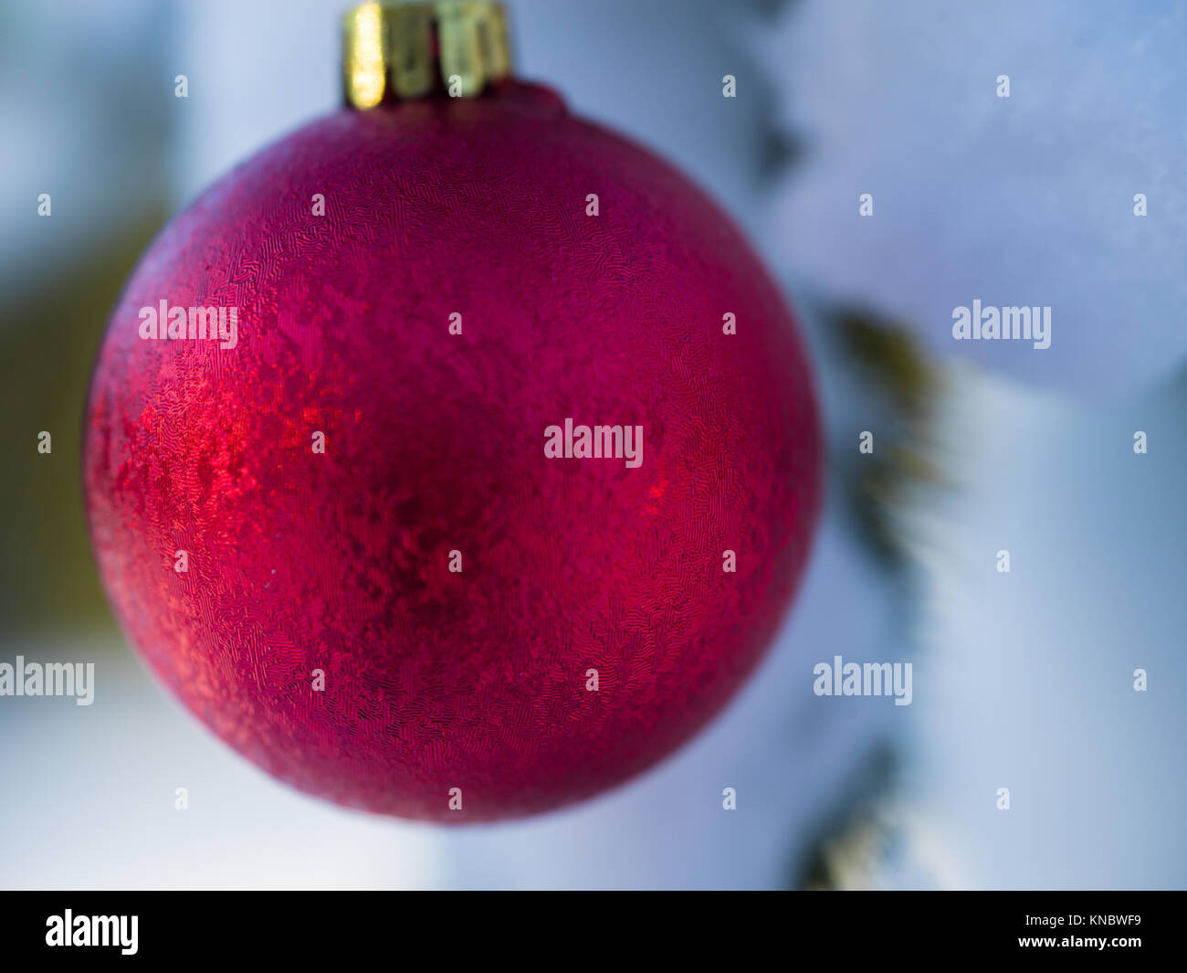 christmas tree red ball decoration with real snow Stock Photo - Alamy
