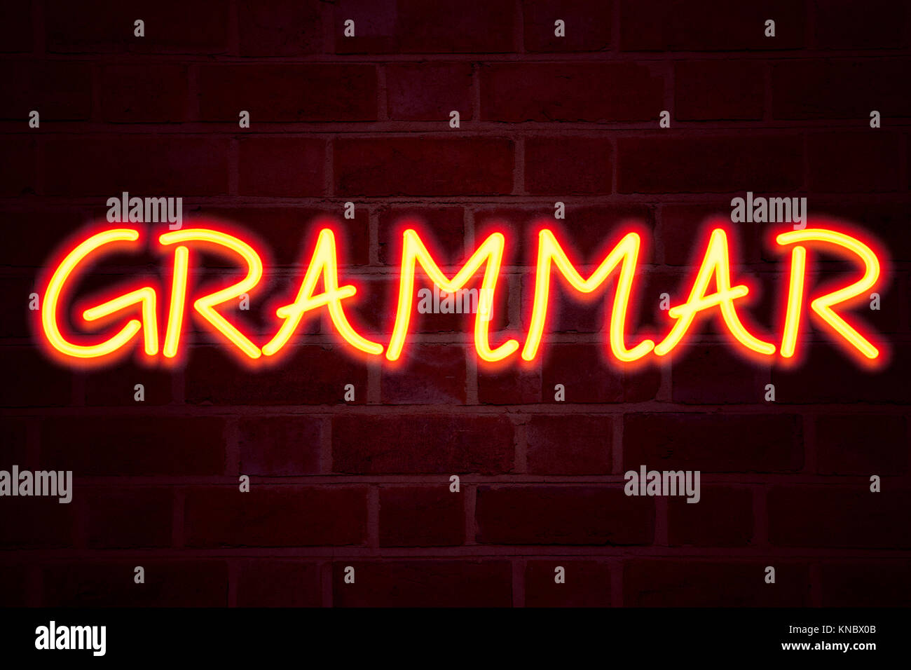 Grammar neon sign on brick wall background. Fluorescent Neon tube Sign ...