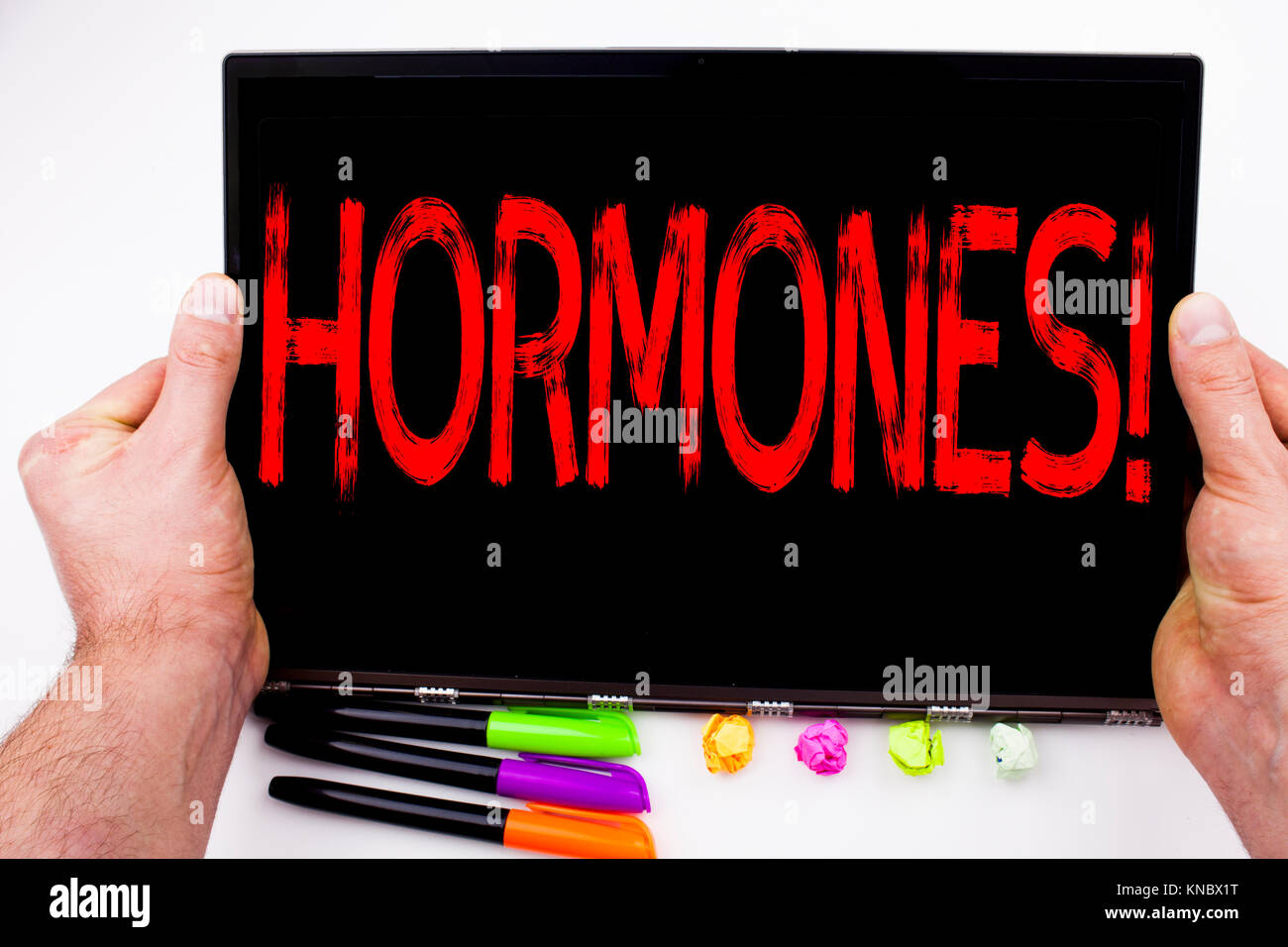 Hormones text written on tablet, computer in the office with marker ...