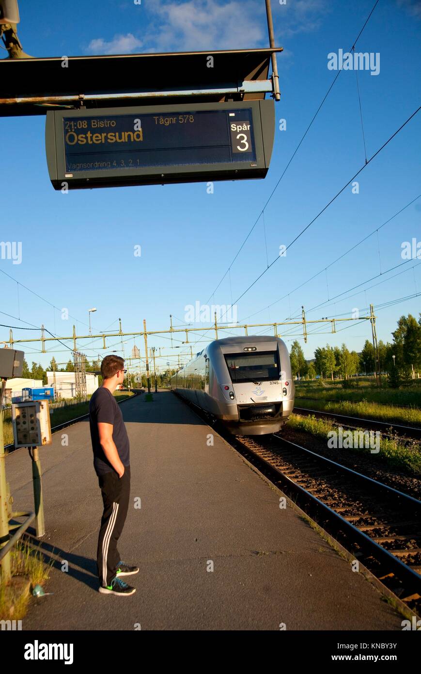 Man waiting for his train hi-res stock photography and images - Alamy