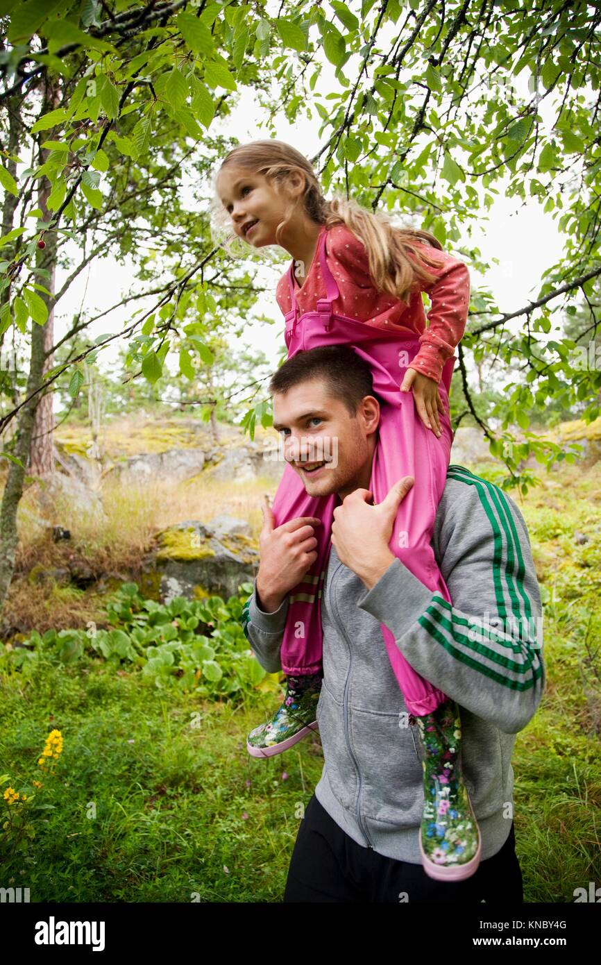 Girl sitting mans shoulder hi-res stock photography and images - Alamy