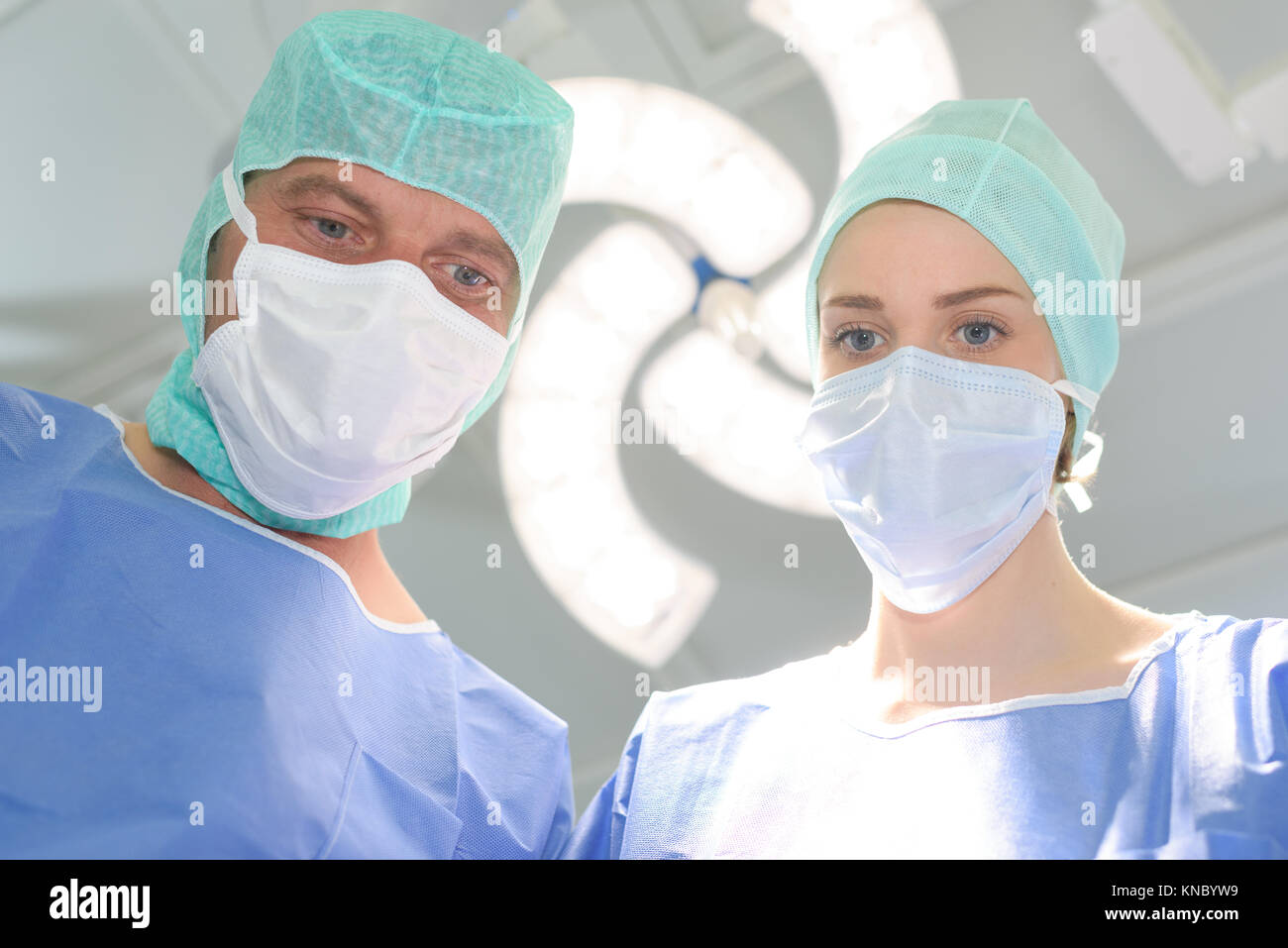 two surgeons working on patient Stock Photo - Alamy