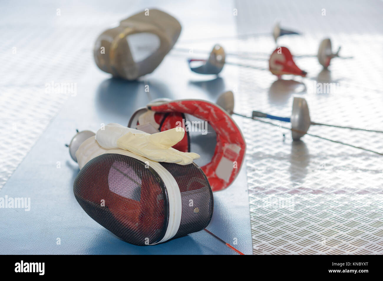 fencing mask and rapier on floor Stock Photo - Alamy