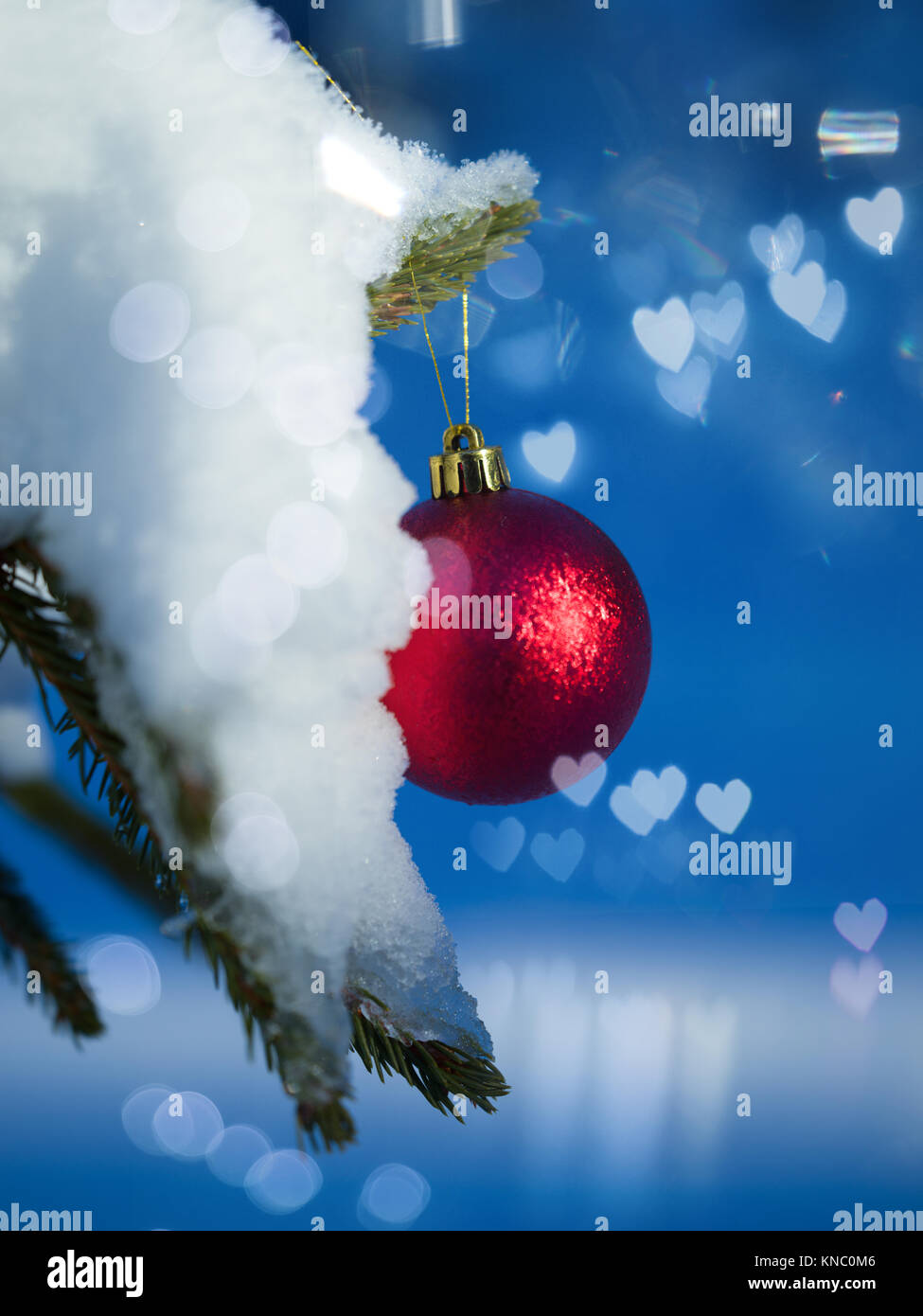 christmas tree red ball decoration with real snow Stock Photo - Alamy