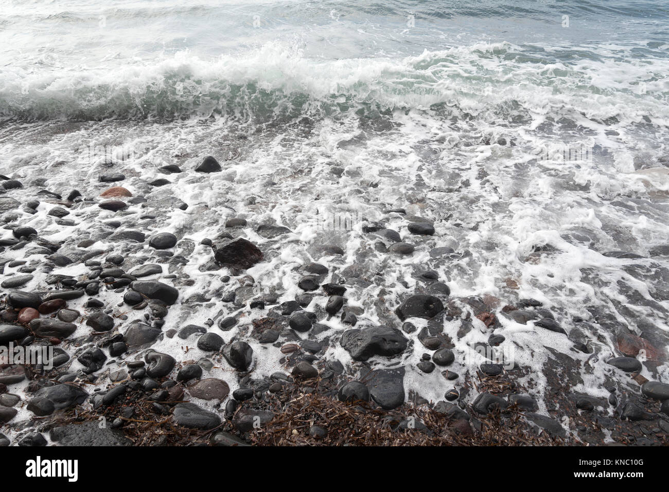 Beach with red sand. The island of Santorini. Volcanic rock, Greece ...