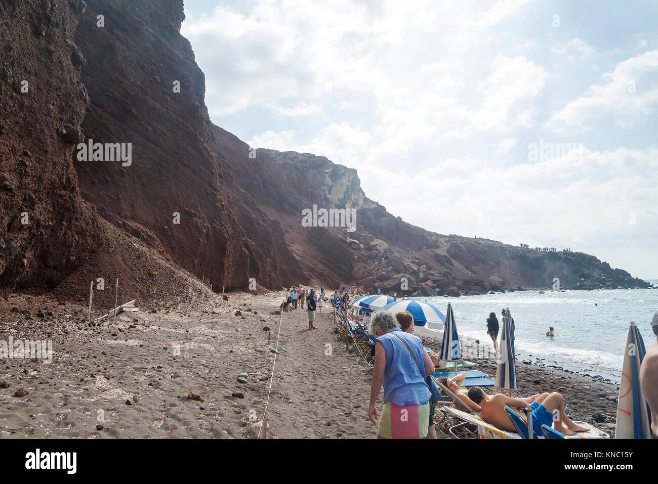Beach with red sand. The island of Santorini. Volcanic rock, Greece ...
