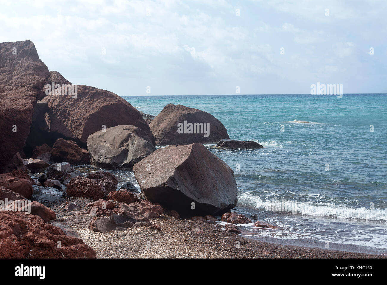 Beach with red sand. The island of Santorini. Volcanic rock, Greece ...