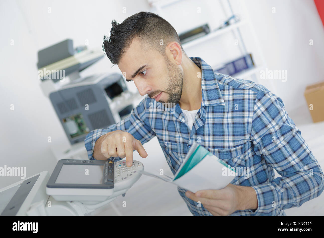 businessman learning to use office printer Stock Photo - Alamy