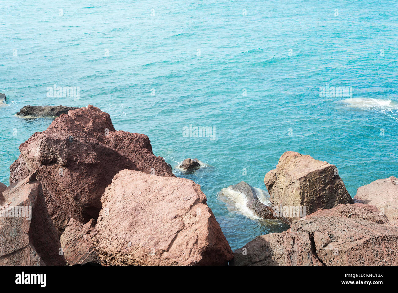 Beach with red sand. The island of Santorini. Volcanic rock, Greece ...