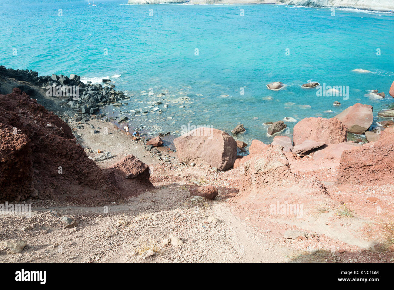 Beach with red sand. The island of Santorini. Volcanic rock, Greece ...