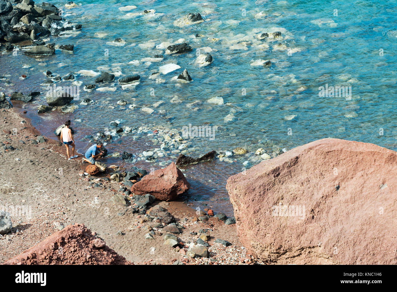 Beach with red sand. The island of Santorini. Volcanic rock, Greece ...