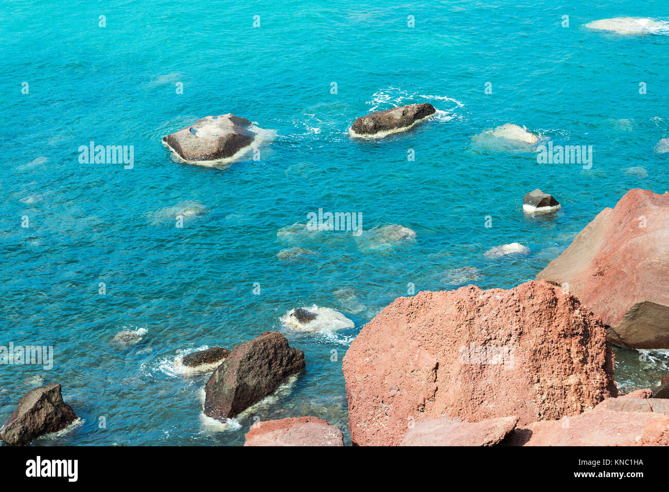 Beach with red sand. The island of Santorini. Volcanic rock, Greece ...