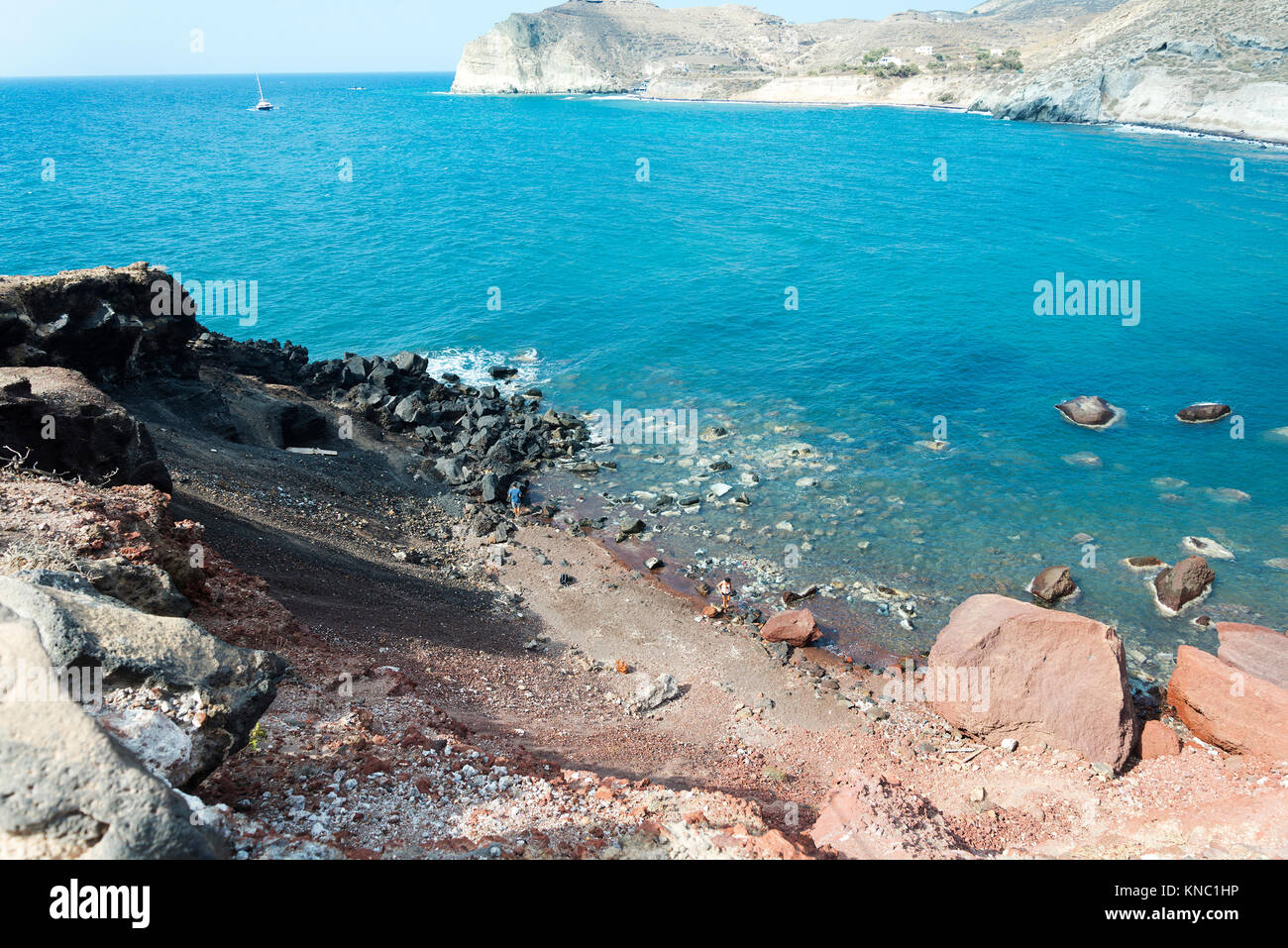 Beach with red sand. The island of Santorini. Volcanic rock, Greece ...