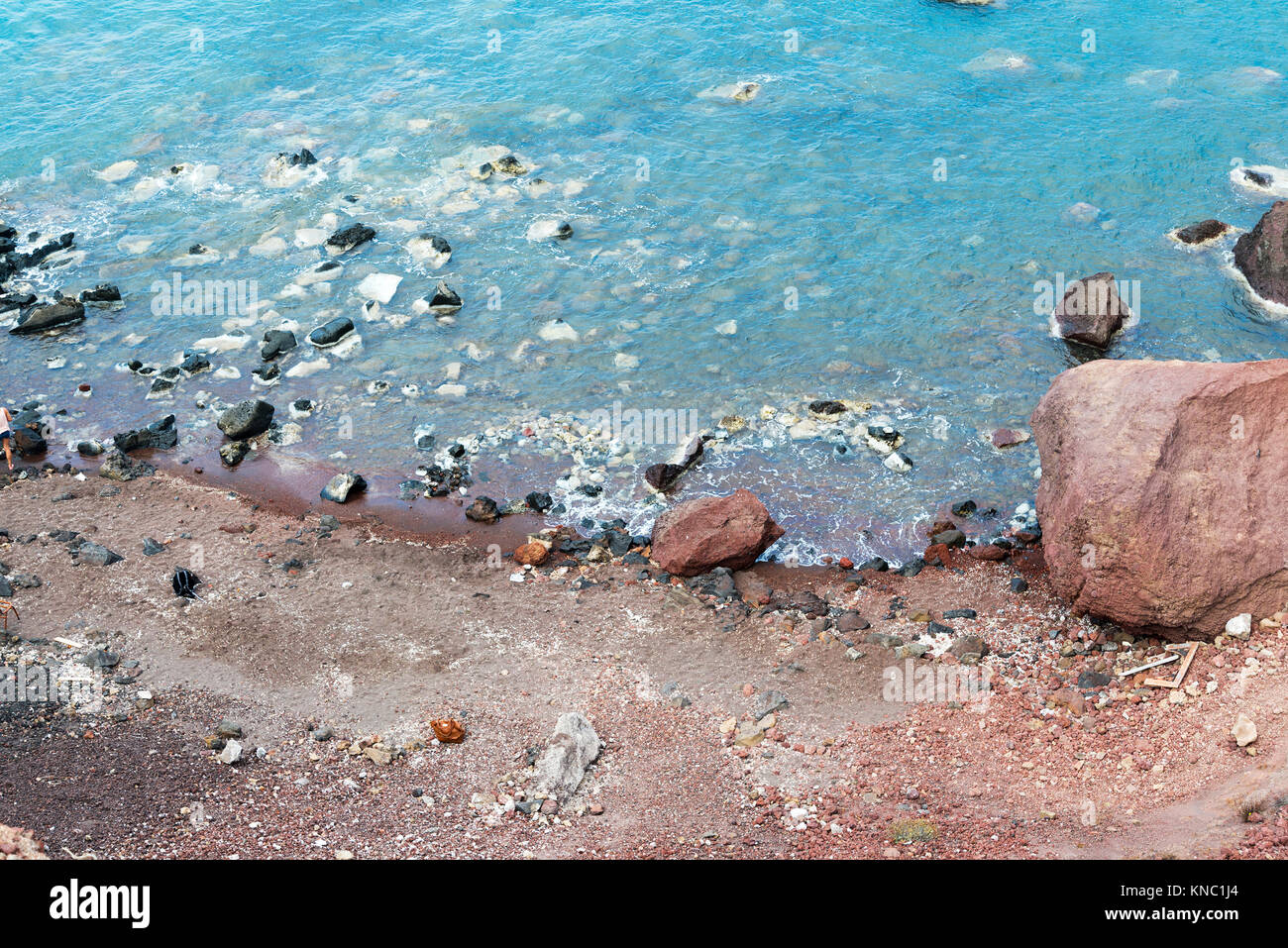 Beach with red sand. The island of Santorini. Volcanic rock, Greece ...