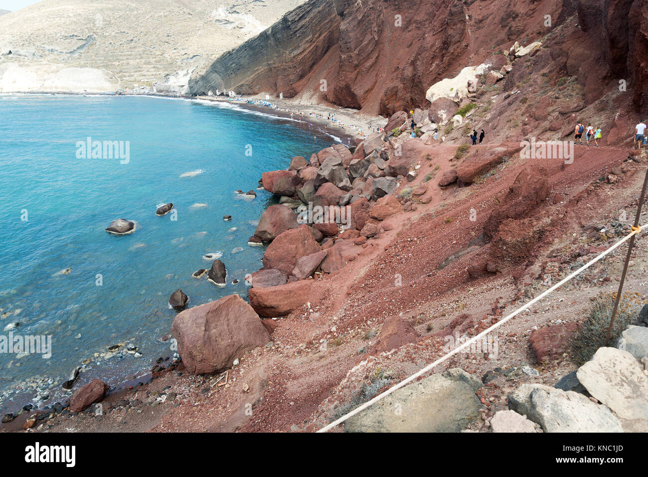Beach with red sand. The island of Santorini. Volcanic rock, Greece ...