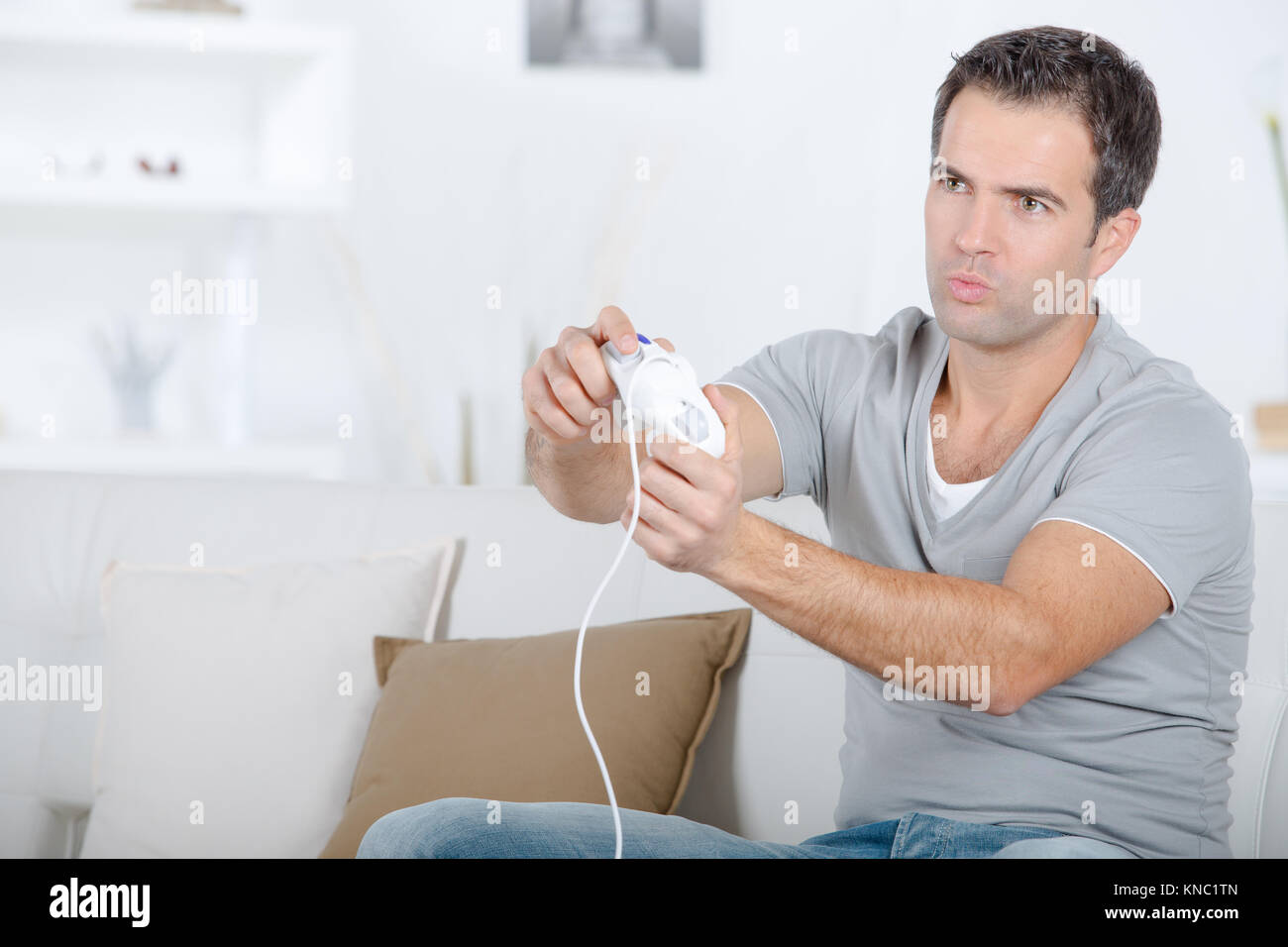 man playing video games alone Stock Photo - Alamy