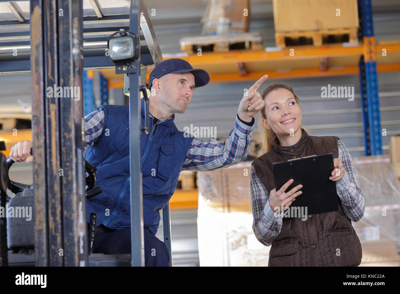 manager talking to his employee in warehouse Stock Photo - Alamy