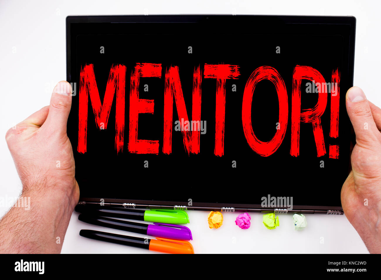 Mentor text written on tablet, computer in the office with marker, pen ...