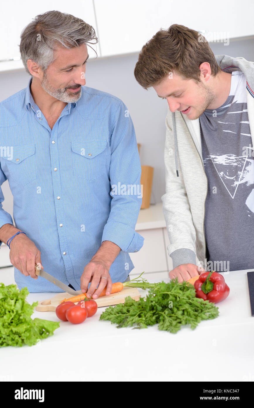 Two men preparing vegetables Stock Photo - Alamy