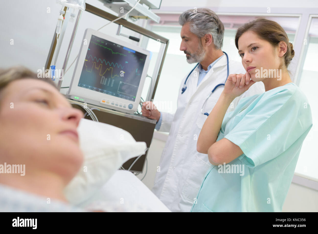 doctor monitoring patients heartbeat in hospital Stock Photo - Alamy