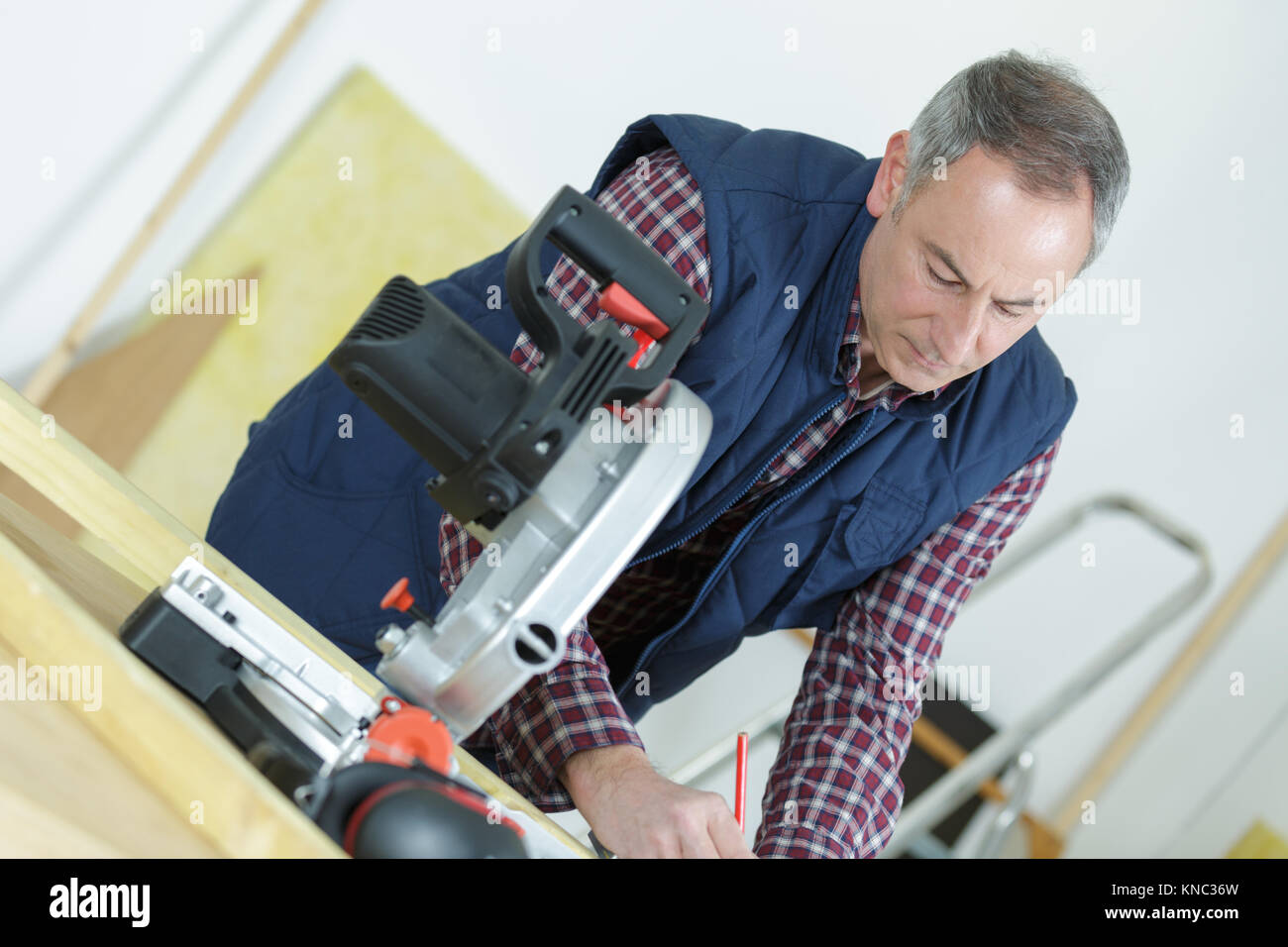 Middle aged carpenter at work Stock Photo - Alamy