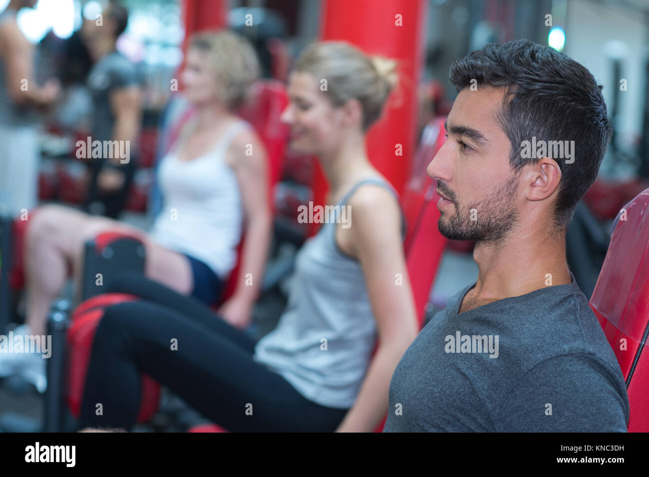healthy man training in gym with people Stock Photo - Alamy