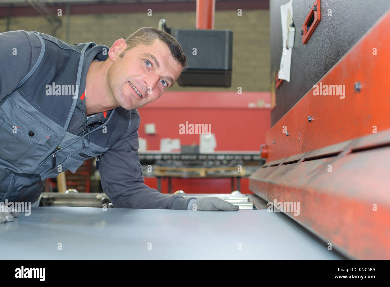 inserting material in the machine Stock Photo - Alamy
