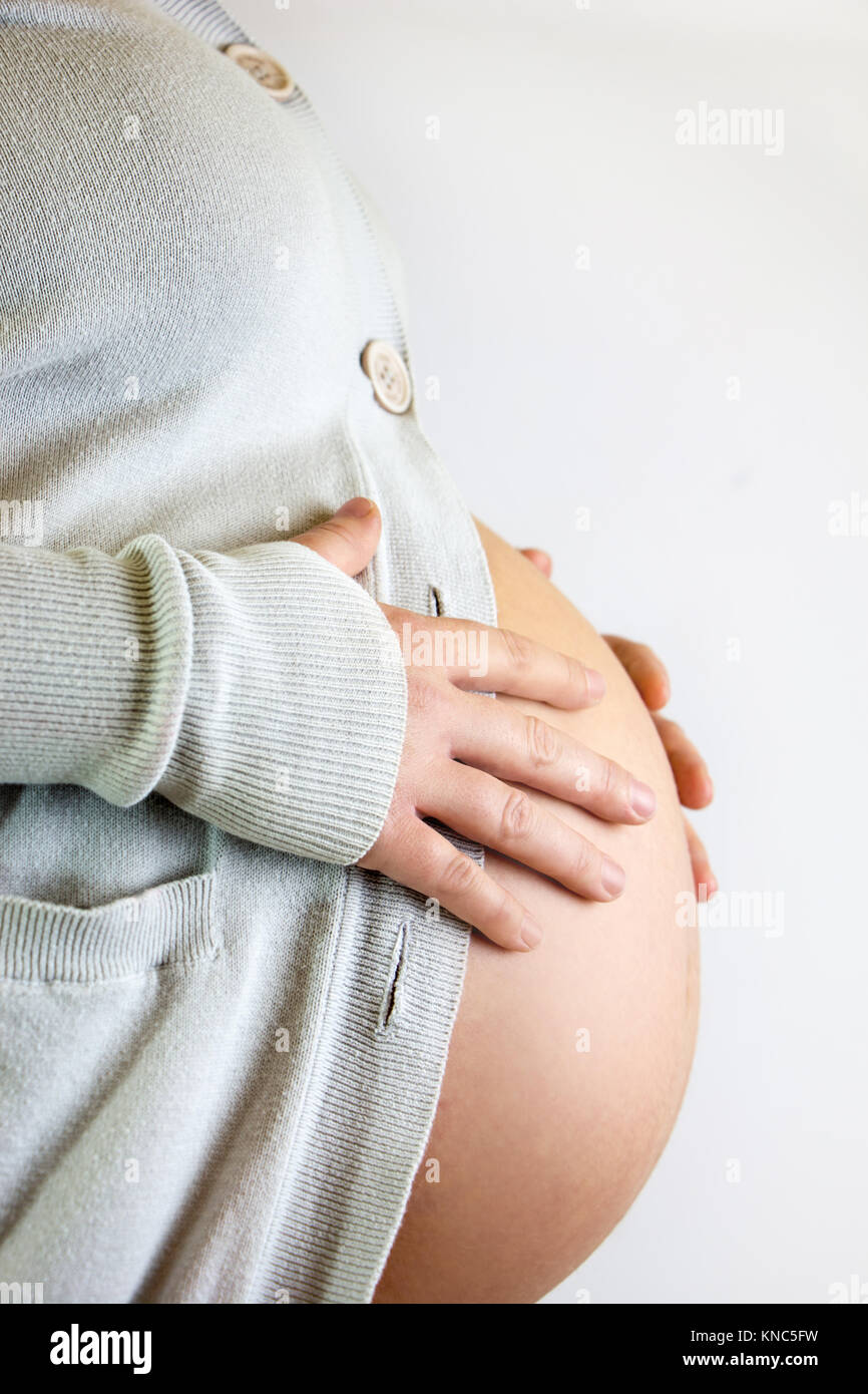 Pregnant woman's big cute belly Stock Photo - Alamy