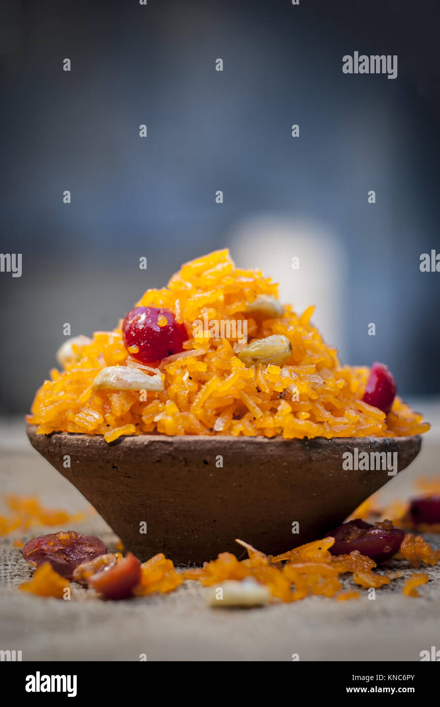 Indian sweet rice dish in a clay bowl on gunny background Stock Photo ...