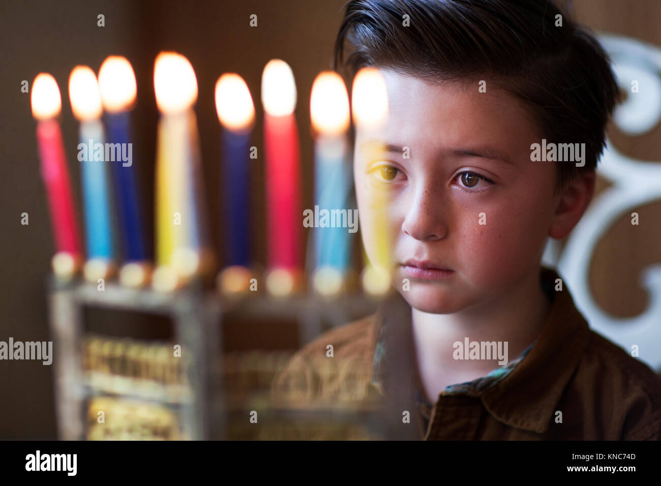 Handsome little Jewish boy with brown styled pompadour staring and ...