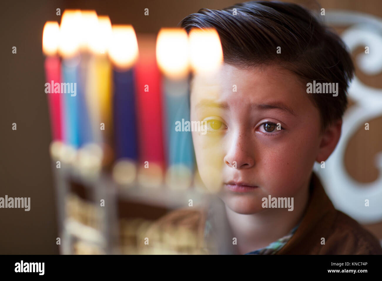 Handsome little Jewish boy with brown styled pompadour staring and ...