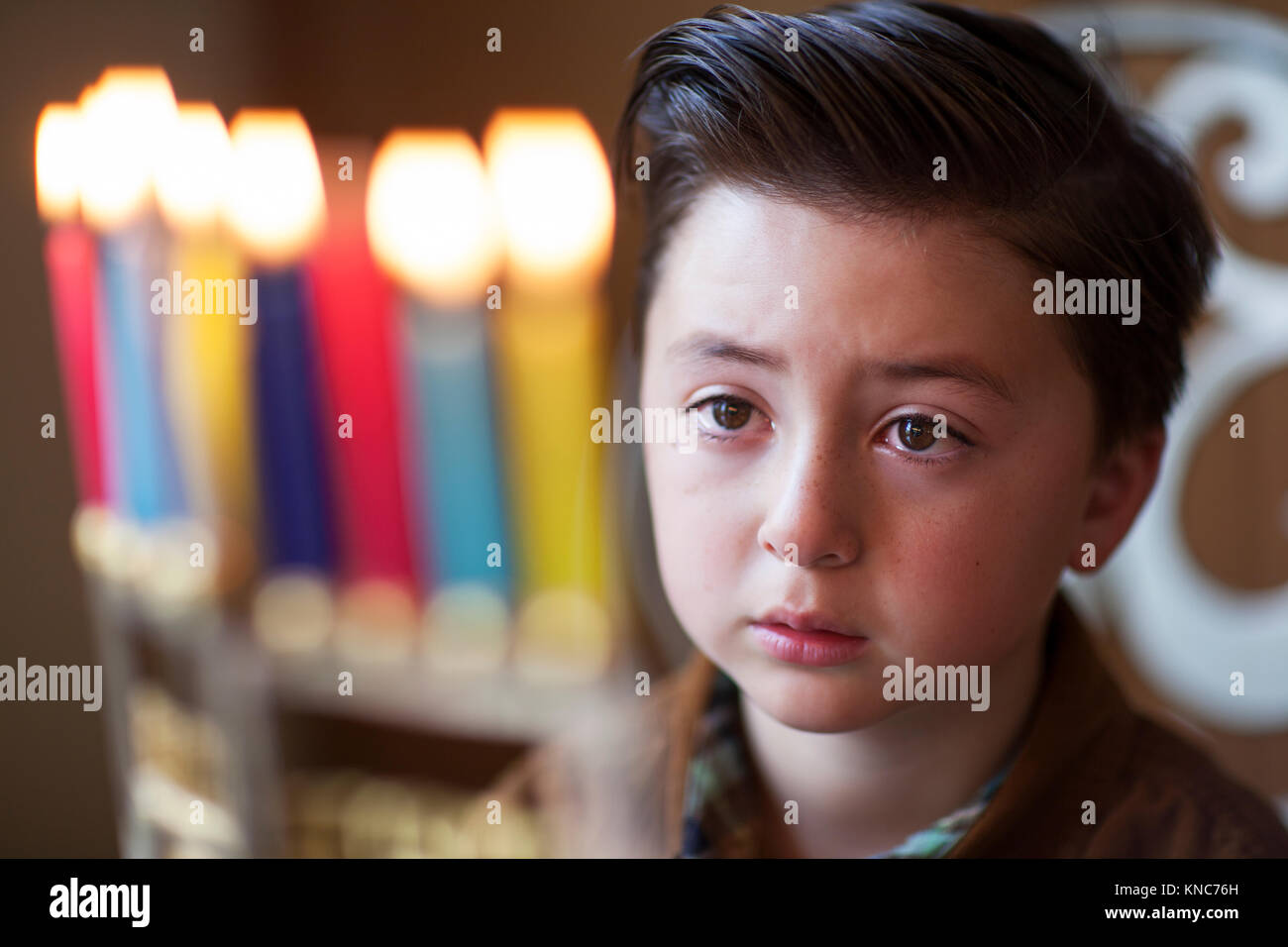 Handsome little Jewish boy with brown styled pompadour staring and ...