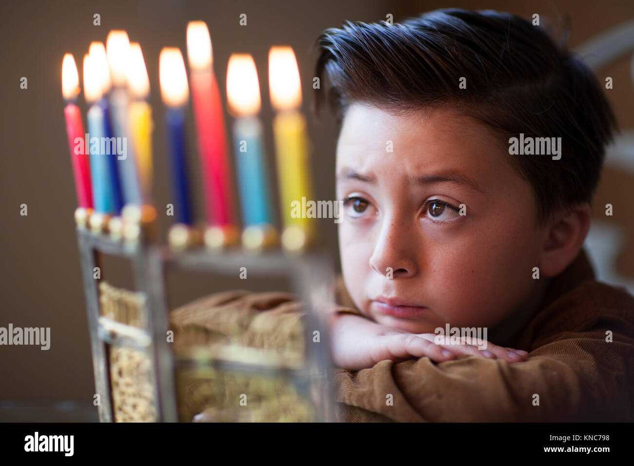 Handsome little Jewish boy with brown styled pompadour staring and ...