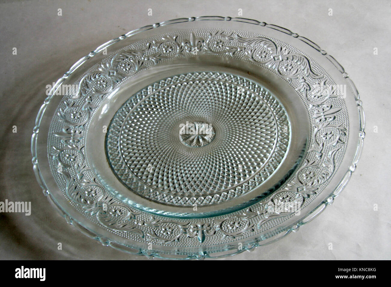 Transparent Glass Plate with intricate design Stock Photo - Alamy