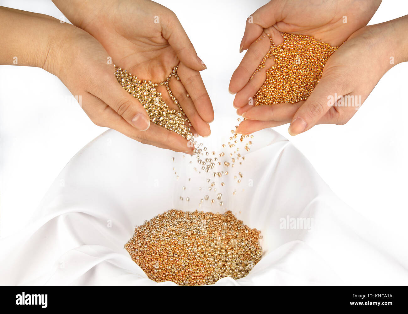 tin and copper grains, close-up in the hands of a lady Stock Photo - Alamy