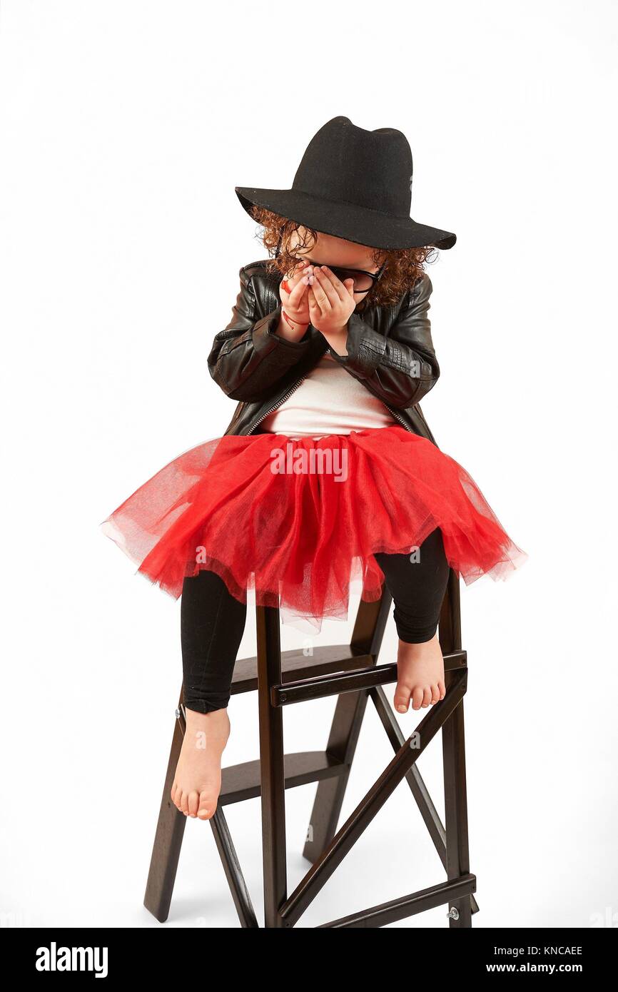 Person sitting on a stool hi-res stock photography and images - Alamy